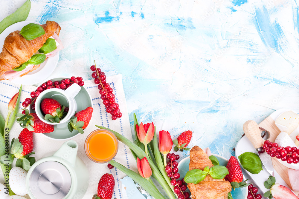 Sweet spring breakfast with croissants and bacon on a light background ...