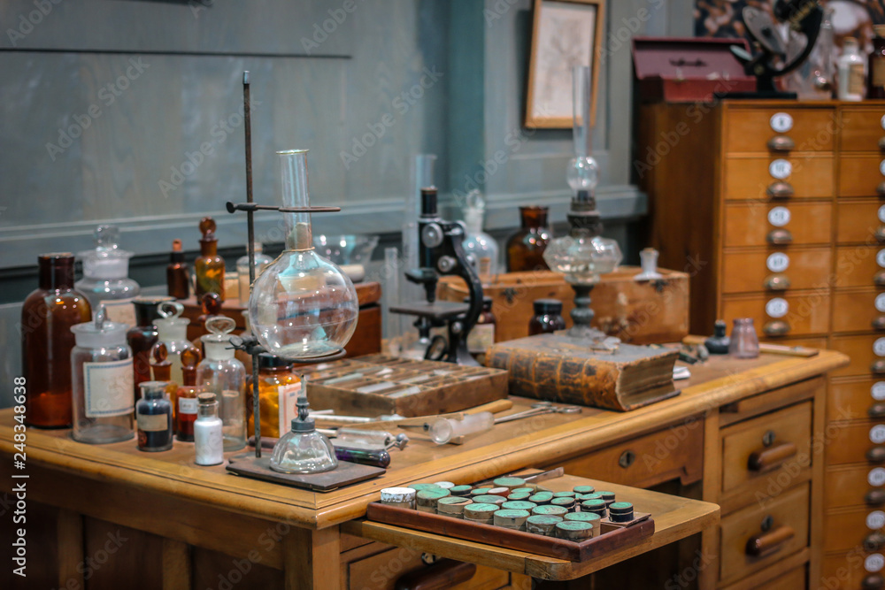 Old science lab with chemical reagents and burner Stock Photo | Adobe Stock