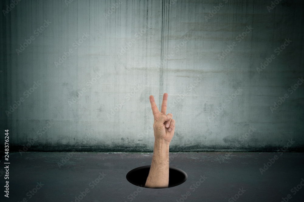 Hand Coming Out Of A Hole