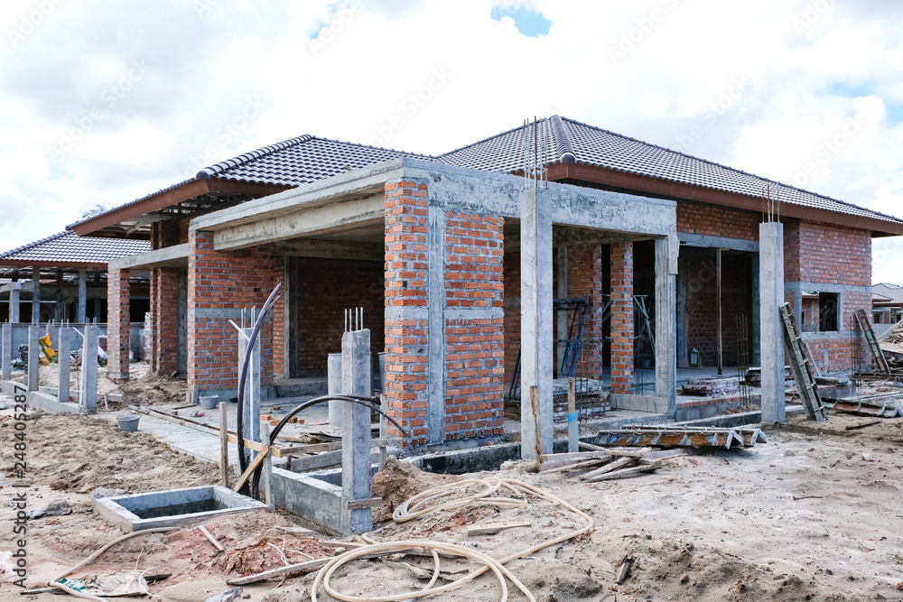 Unfinished single one storey house in housing estate. House ...
