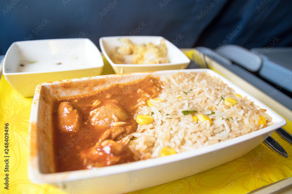 Tray with delicious food on the plane, economy class travel. Tasty meal ...