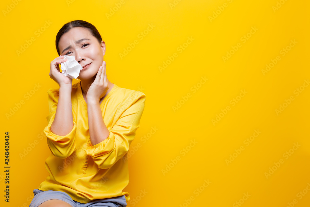 Sad woman crying and wipe her tears by tissue paper Stock Photo | Adobe ...
