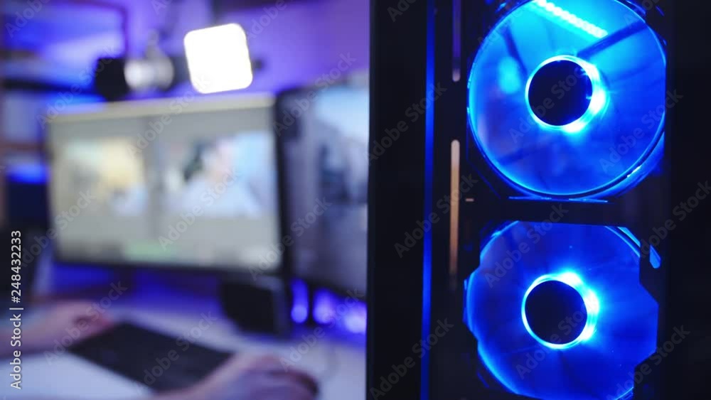 RGB lights PC fans of a professional gamer 4K. Close up shot of PC fans ...