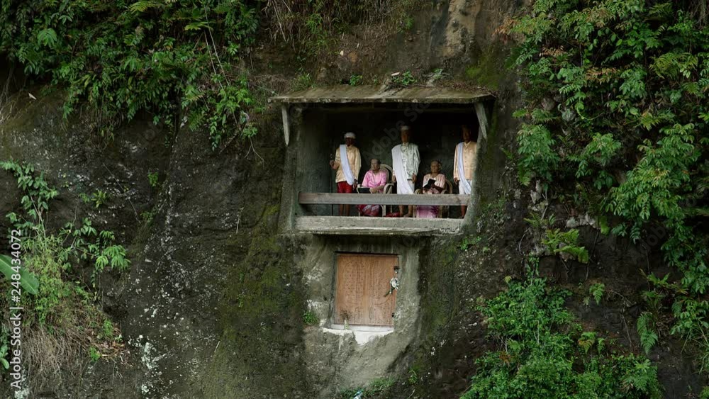Famous funeral of Tana Toraja.Typical Toraja tombs in a vertical rock ...