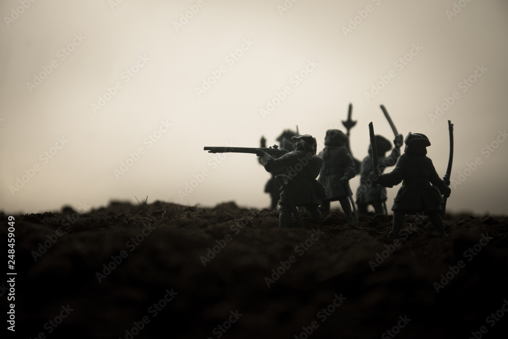 Foto de The musketeer in a black broad-brimmed hat fires an old brown ...