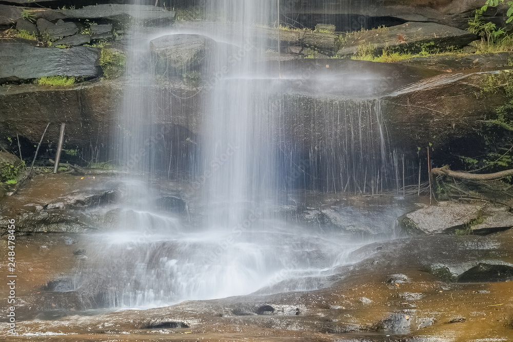 Soi Sawan Waterfall, beautiful waterfall hitting on surface of arch ...