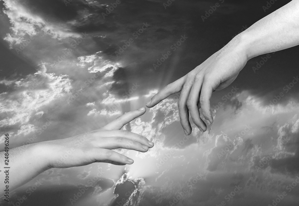 Two hands on a light background, a replica of the plot of Michelangelo ...