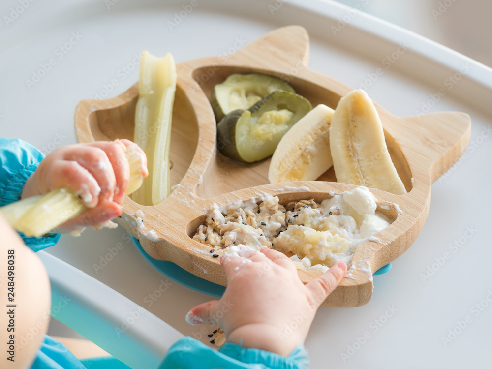 Baby eating by hands, Baby eating organic bio vegetables with BLW ...