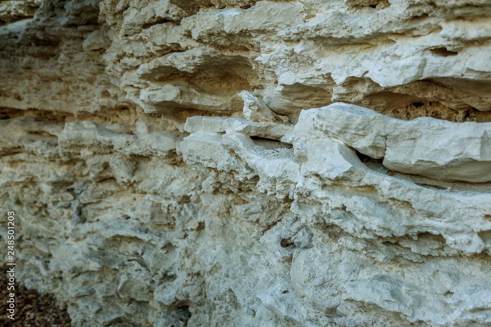 Picturesque background of collapsing surface of limestone rock ...