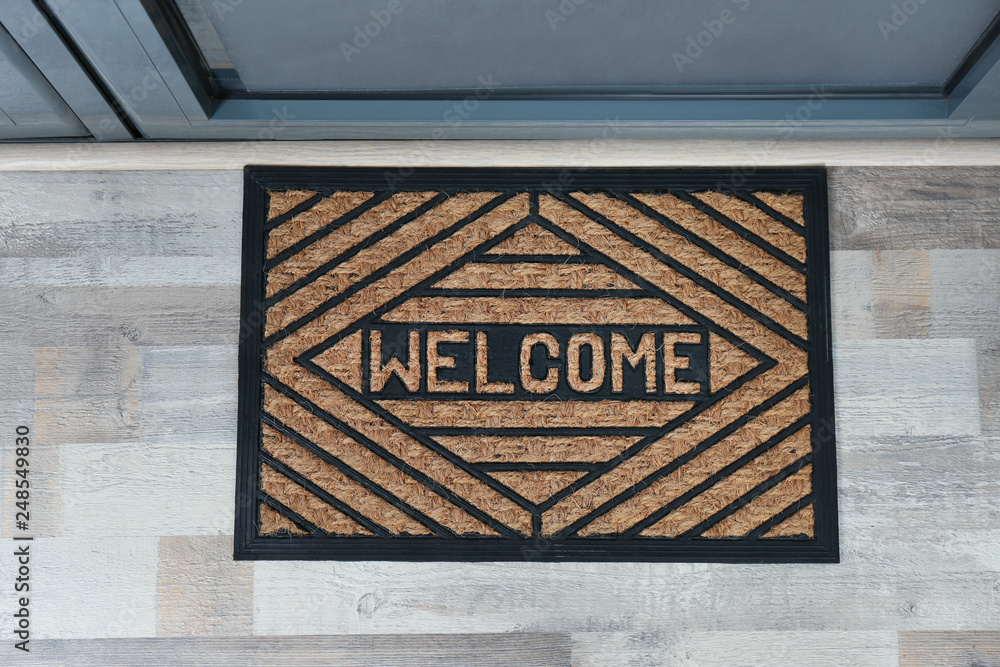 New clean mat with word WELCOME near entrance door, top view Stock ...