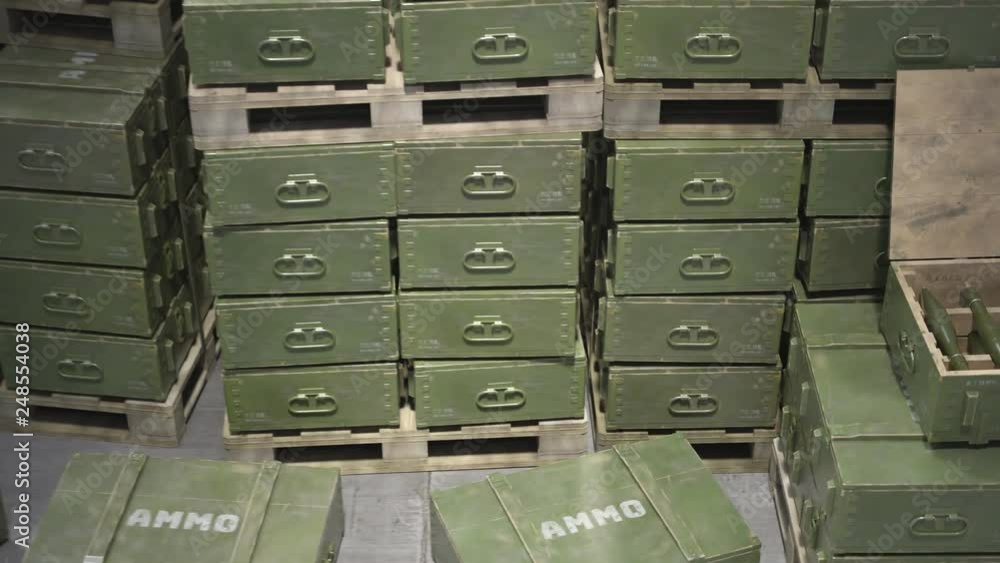 Huge stack of ammo boxes with RPG missiles and rifle ammunition in ...