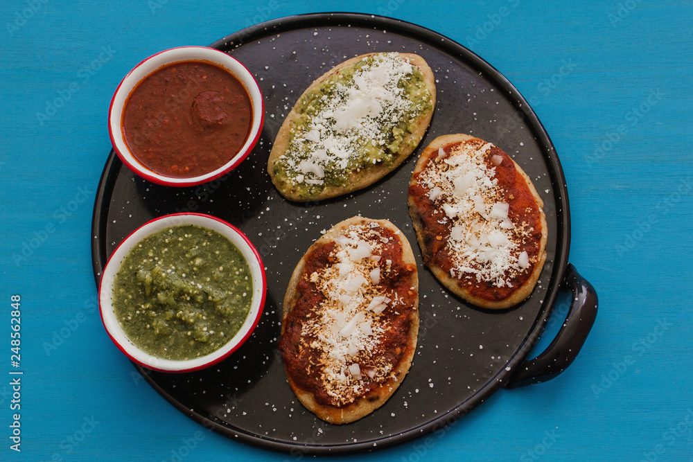 Tlacoyos Mexican food, green and red sauce in Mexico city spicy food ...