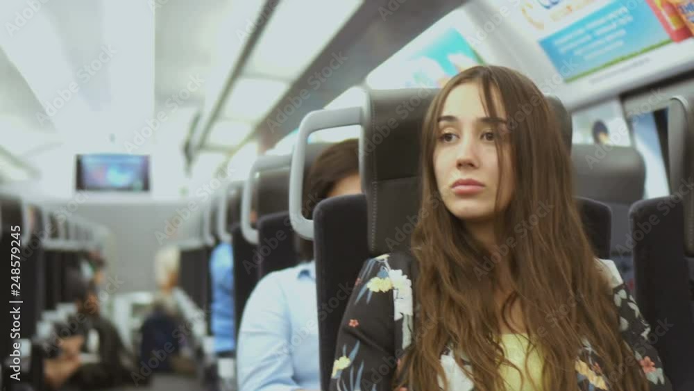 Beauty girl model with sad, tired face ride on bus. Passenger woman ...