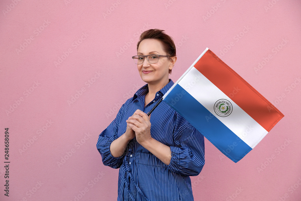Paraguay flag. Woman holding Paraguayan flag. Nice portrait of middle ...