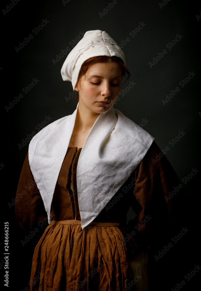 Medieval maid posing in studio Stock Photo | Adobe Stock