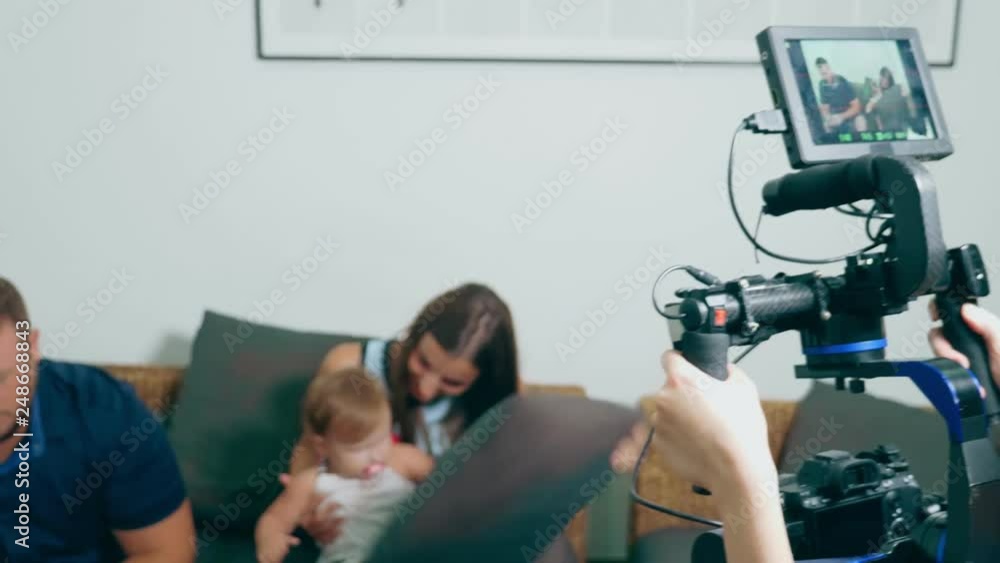 video shooting process. An operator with a steadicam shoots a story ...