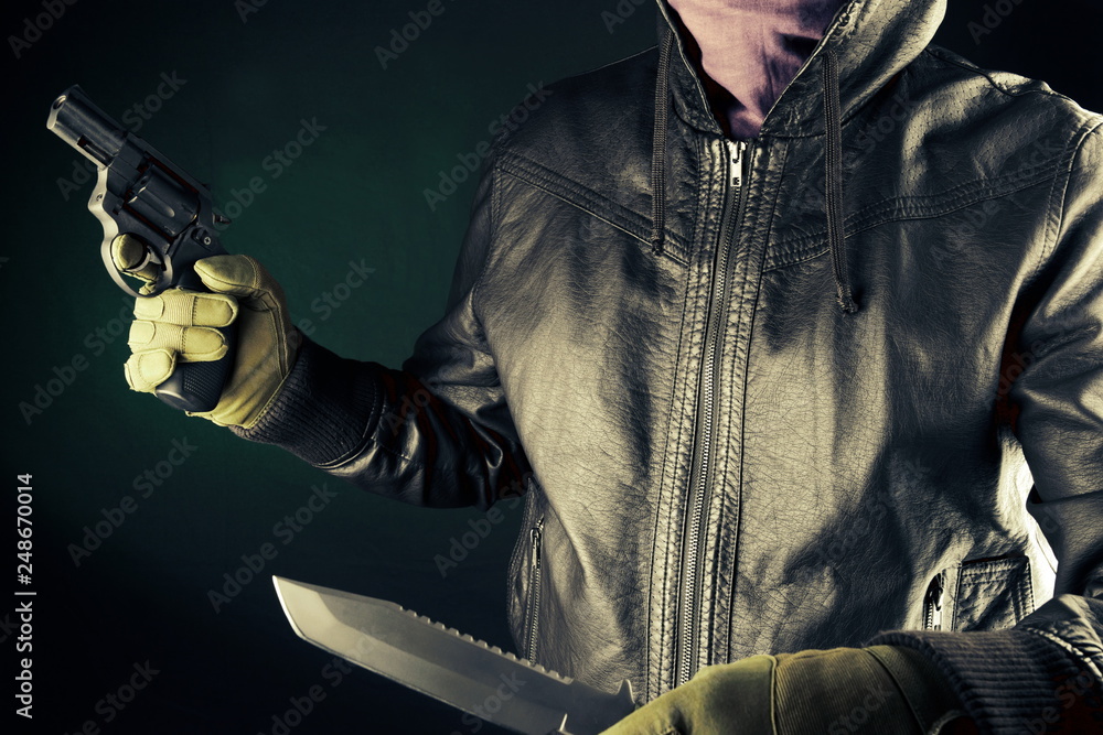 Dangerous criminal hold gun in hand.Large revolver ready for robbery or ...