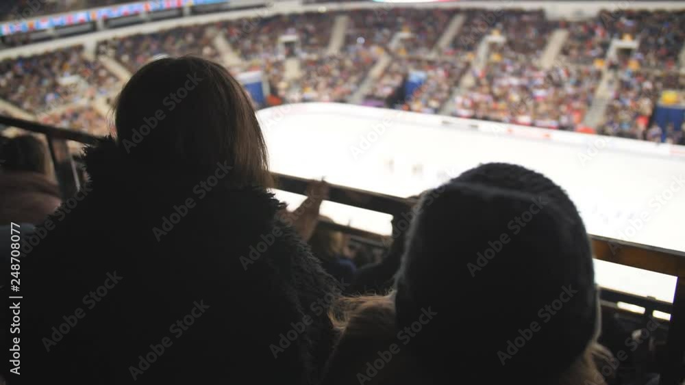 Fans sit and clap their hands on the ice arena during the World Cup in ...