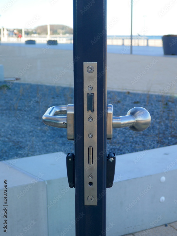 Open glass door, details of the side view. Close-up of door handle ...