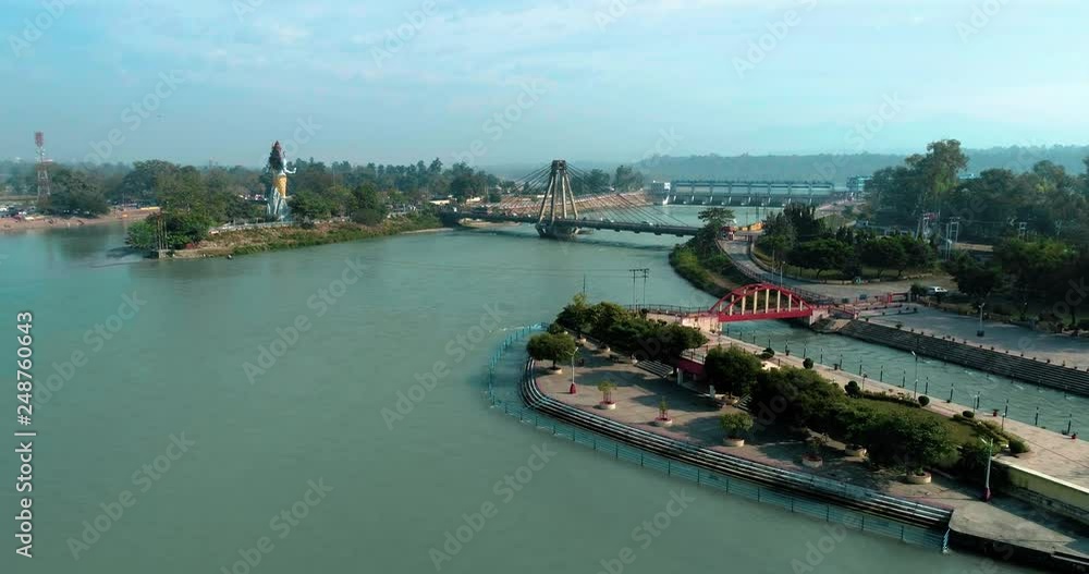 Wide aerial shot of Holy city Haridwar showing the big statue of Hindu ...