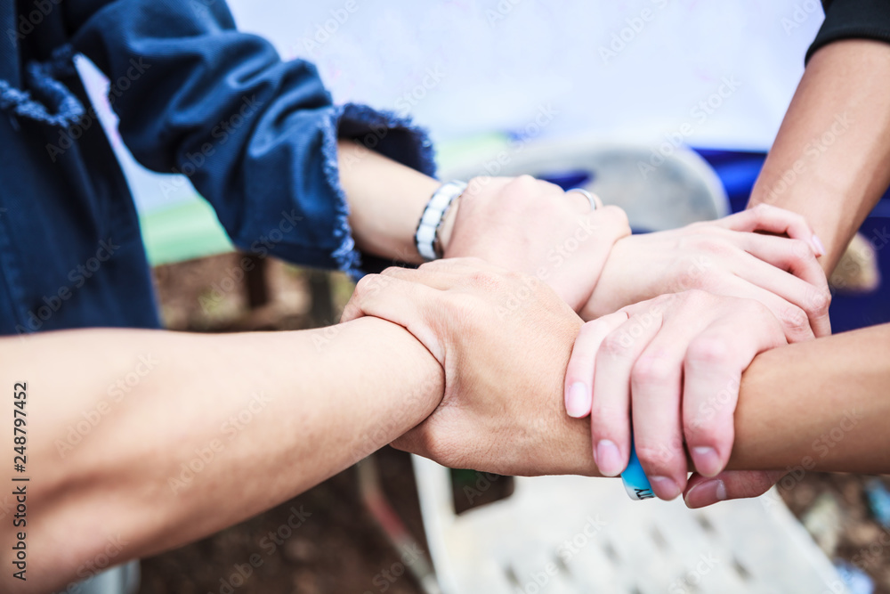 Young People Teamwork Meeting join hands in rectangle on natural ground ...