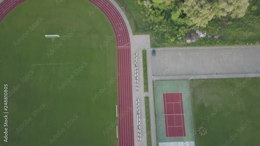 Running track of the stadium with a bird's-eye view. Span drone over the sports complex in the ...