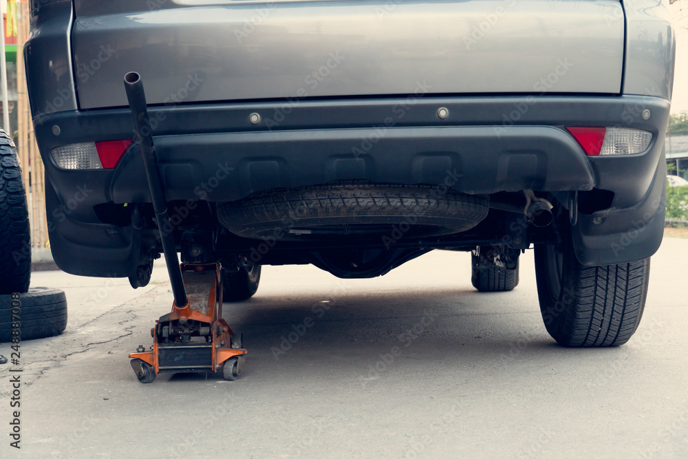 Car maintenance by using a car engine to lift cars to change tires For ...