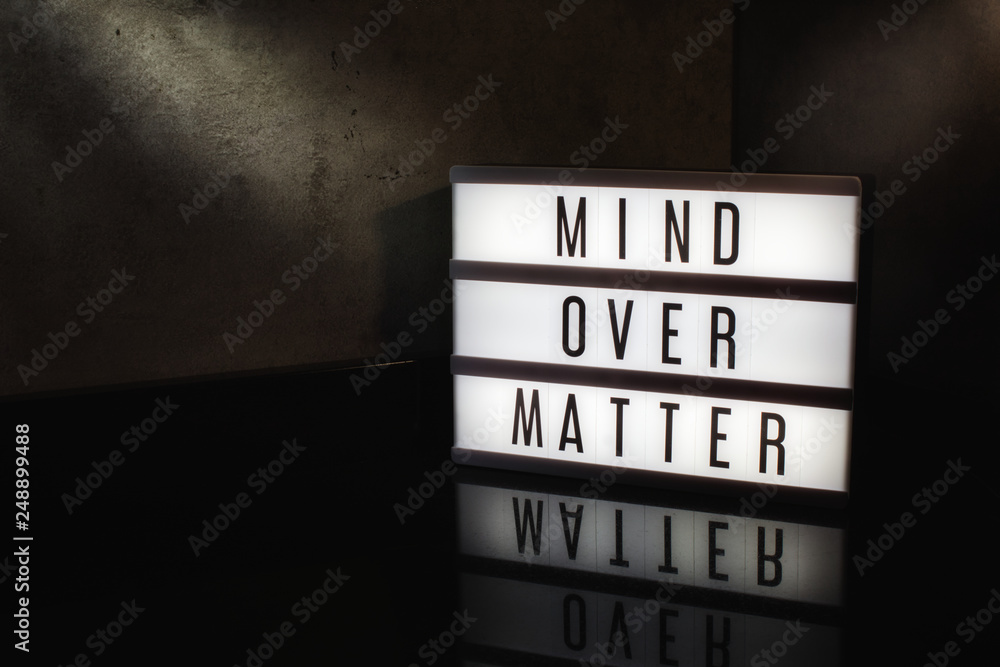 Mind over matter motivational message on a light box in a cinematic ...