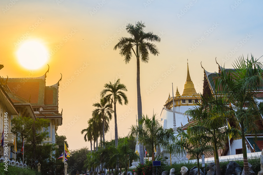 Beautiful sunset at Wat Saket Ratcha Wora Maha Wihan (Wat Phu Khao Thong, Golden Mount temple ...