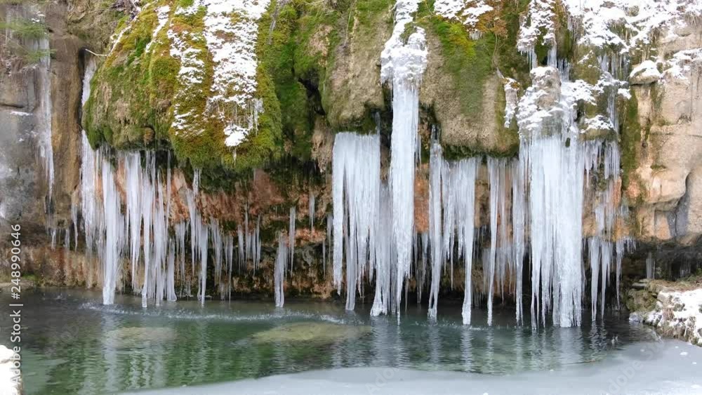 Kalktuffquelle. Frozen waterfall with dripping water in Mullerthal ...