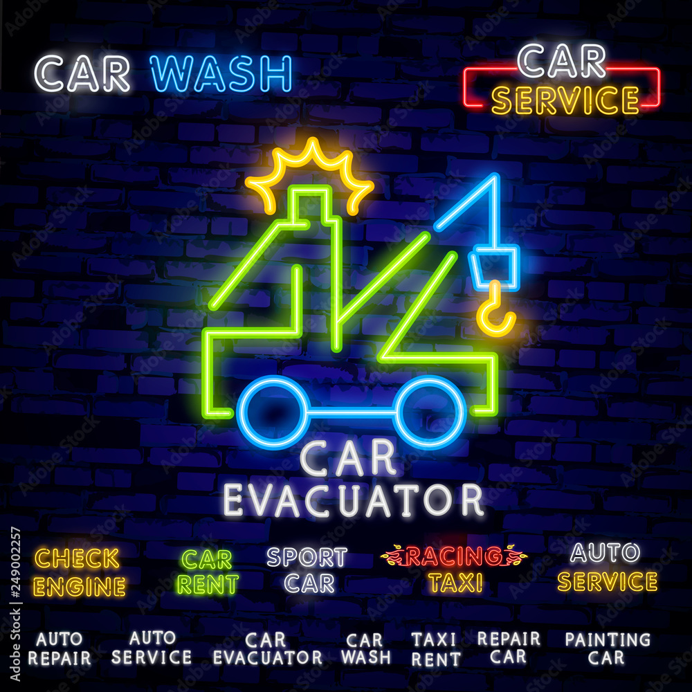 Tow trucks neon text with car being evacuated. Car evacuation ...