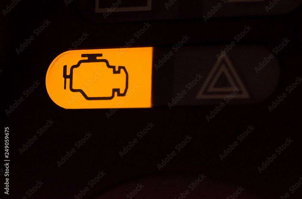 Warning sign of a car engine, orange engine sign on a panel of car ...
