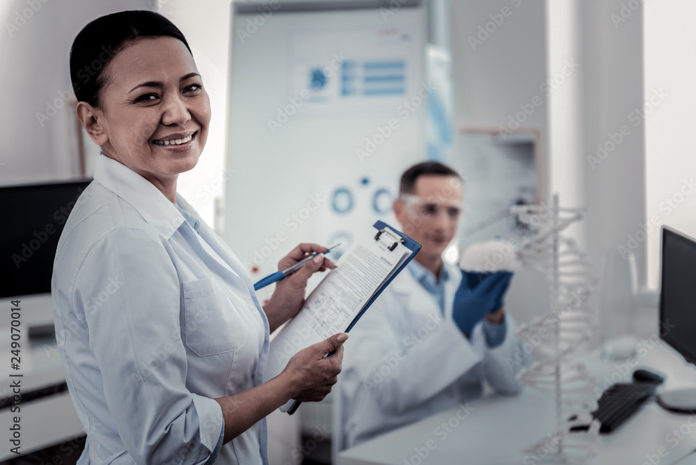 Assistant writing the protocol of laboratory research Stock Photo ...
