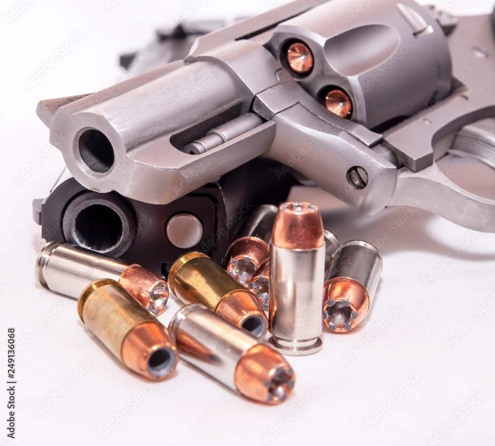 Two handguns, a 40 caliber pistol and a 357 magnum revolver with 40 ...