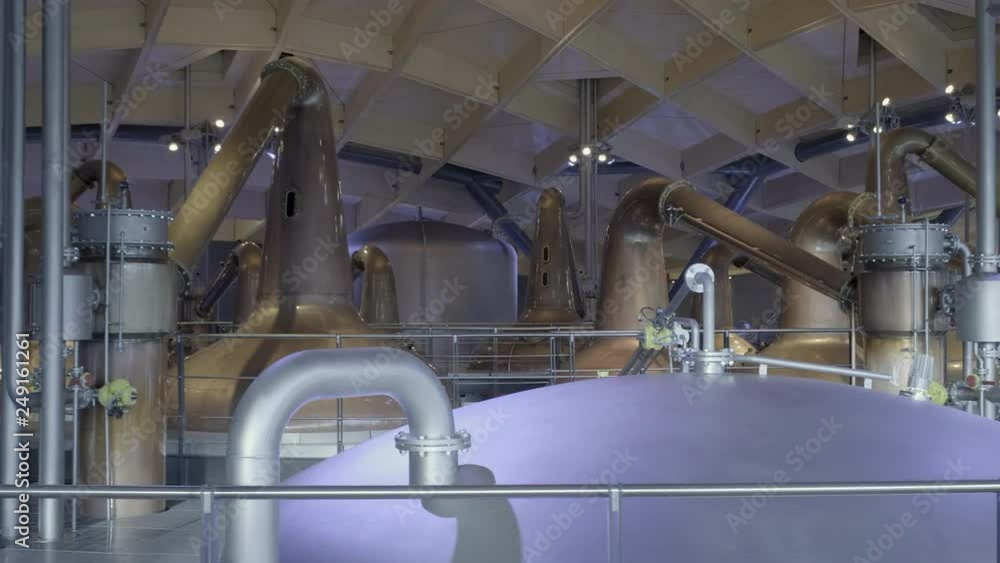 Interior pipework, copper stills and mash tuns highlighting the ...