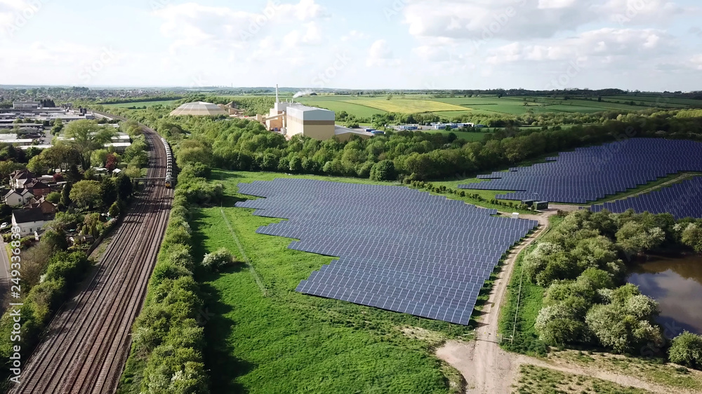 solar energy panels farm and the train railway and industrial factories ...