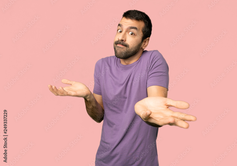 Handsome man making unimportant gesture while lifting the shoulders on ...