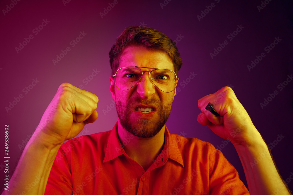 Screaming, hate, rage. Crying emotional angry man screaming on pink ...