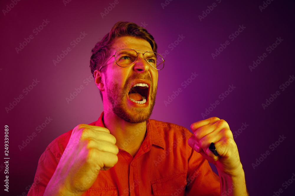 Screaming, hate, rage. Crying emotional angry man screaming on pink ...