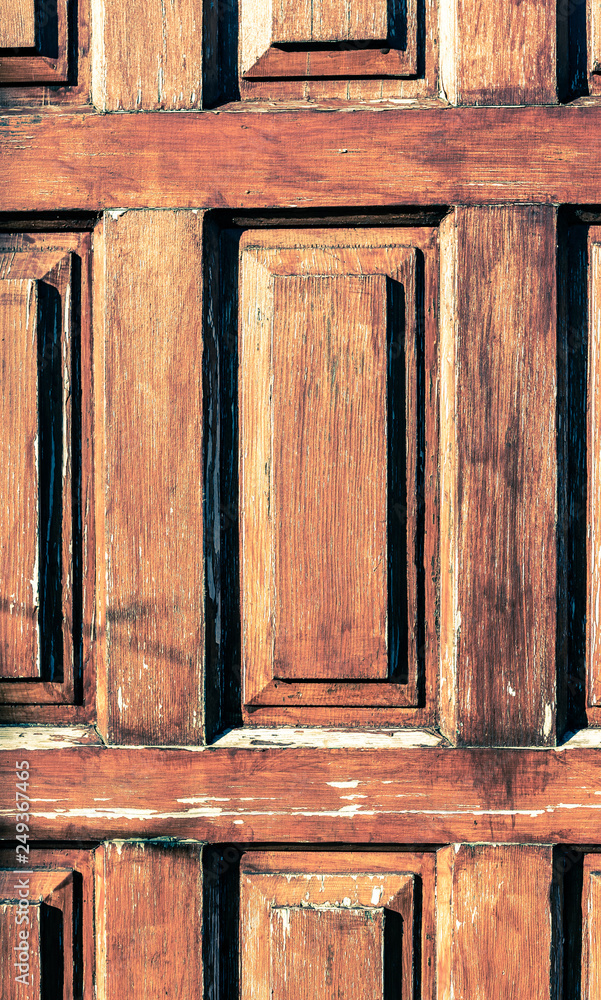 Wooden door showing the texture in the shadow and highlighting the ...