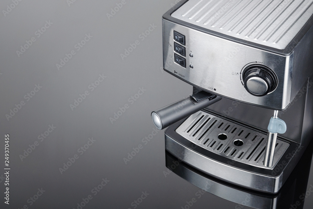 Espresso coffee machine on the grey mirror background with copy space ...