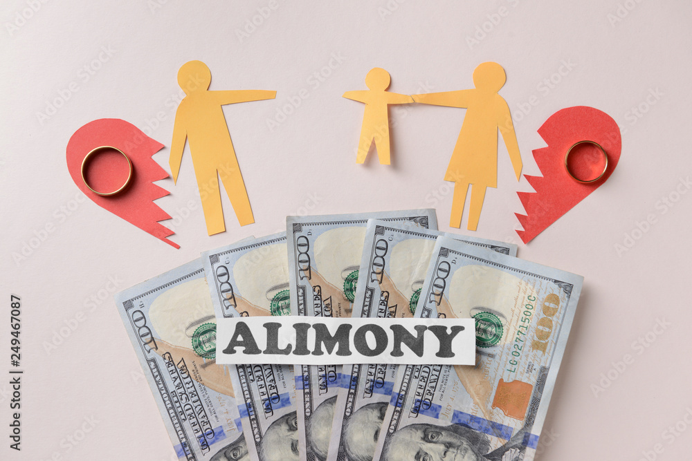 Word ALIMONY with money, paper figures of family and rings on light ...