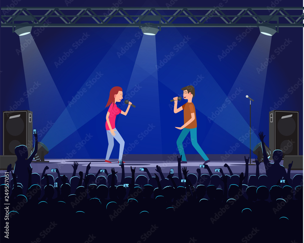Couple of performers singing song with microphone on scene. People ...