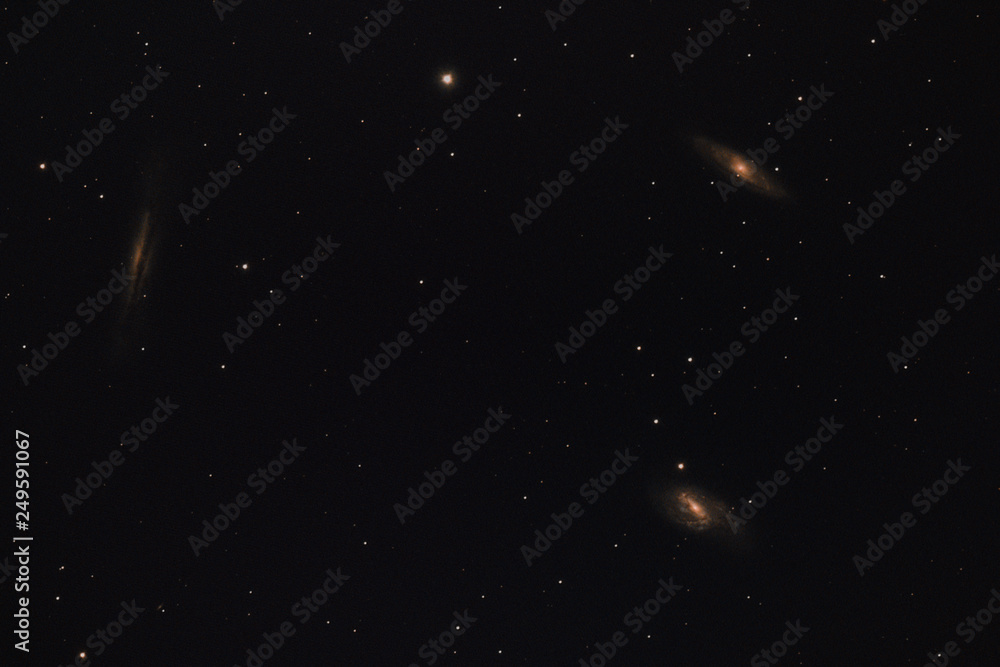 The three spiral galaxies M65, M66, and the Hamburger Galaxy NGC 3628 ...