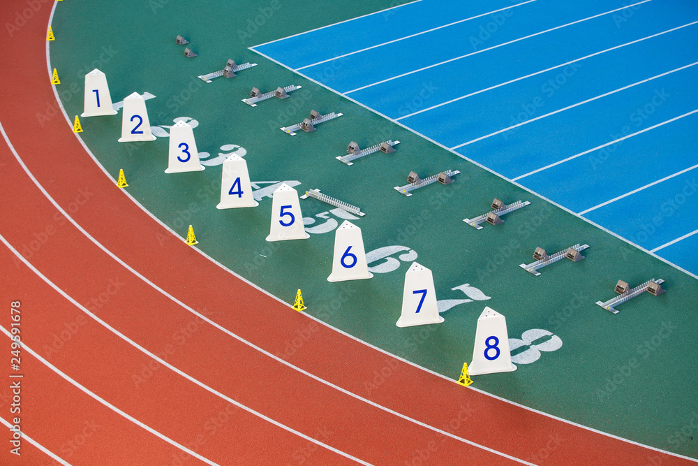 Sprint start line with blocks on track and field Stock Photo | Adobe Stock