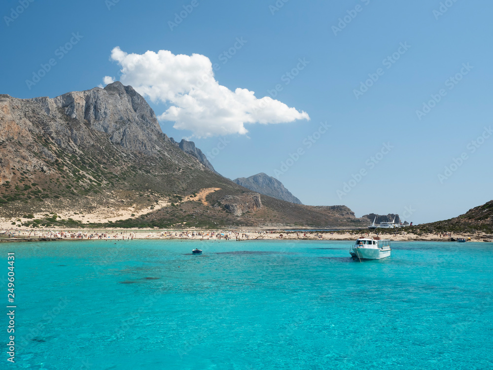 Balos Lagoon Blue sea, hills and boat, transparent water as a swimming ...