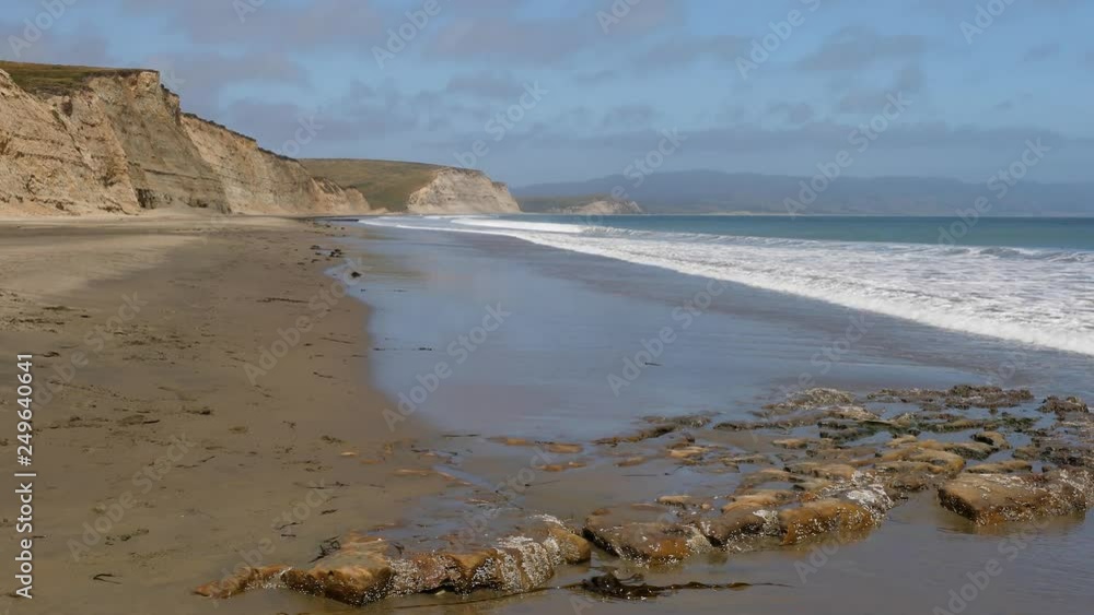 Seamlessly Looping Footage Features Pacific Ocean Waves Breaking Gently