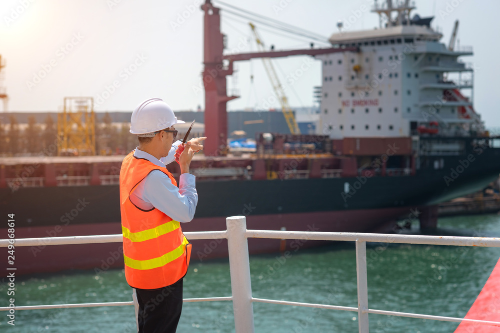 pilot, harbor master port control in command the ship to takes berthing ...