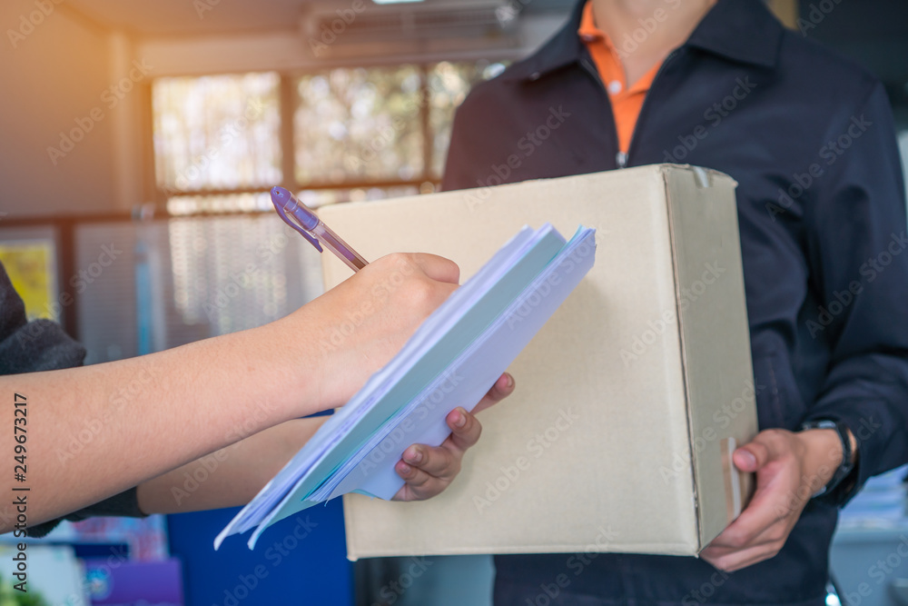 Signing receipt of delivery box package in document form, Sign receipt ...