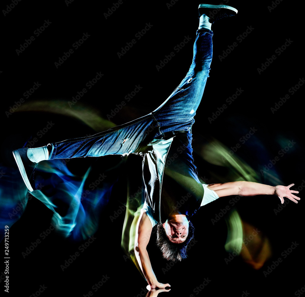 one chinese young man hip hop break dancer dancing isolated on black ...